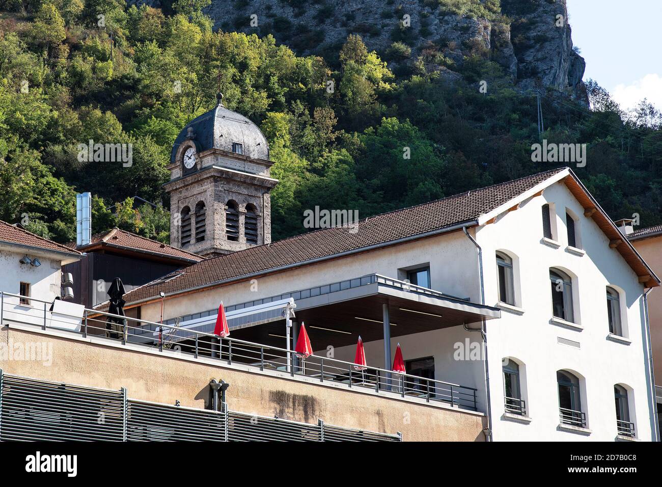 Original house facade with a belfry and a forest Stock Photo - Alamy