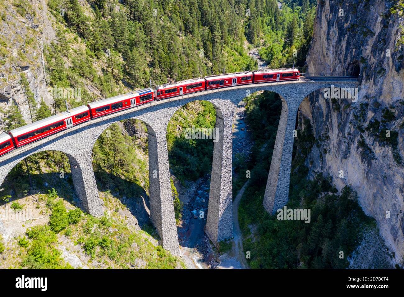Amazing aerial view of train passing the Landwasserviadukt near Filisur ...