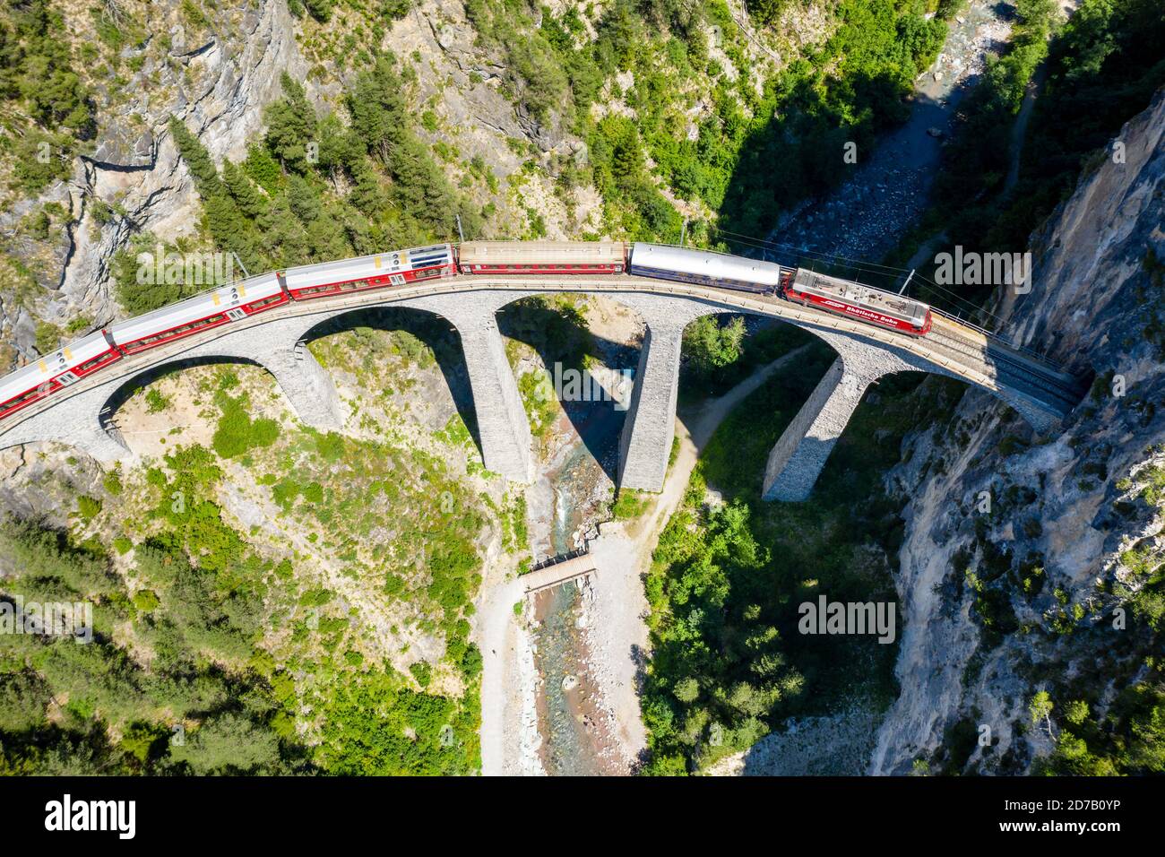 Amazing aerial view of train passing the Landwasserviadukt near Filisur ...