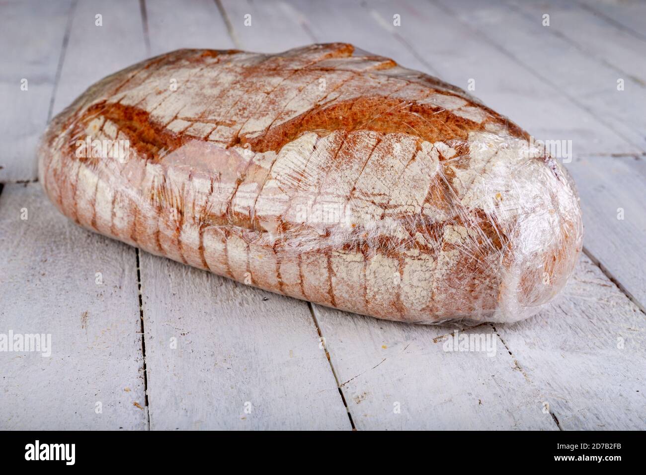 Well done bread wrapped in plastic wrap. Food prepared for transport ...