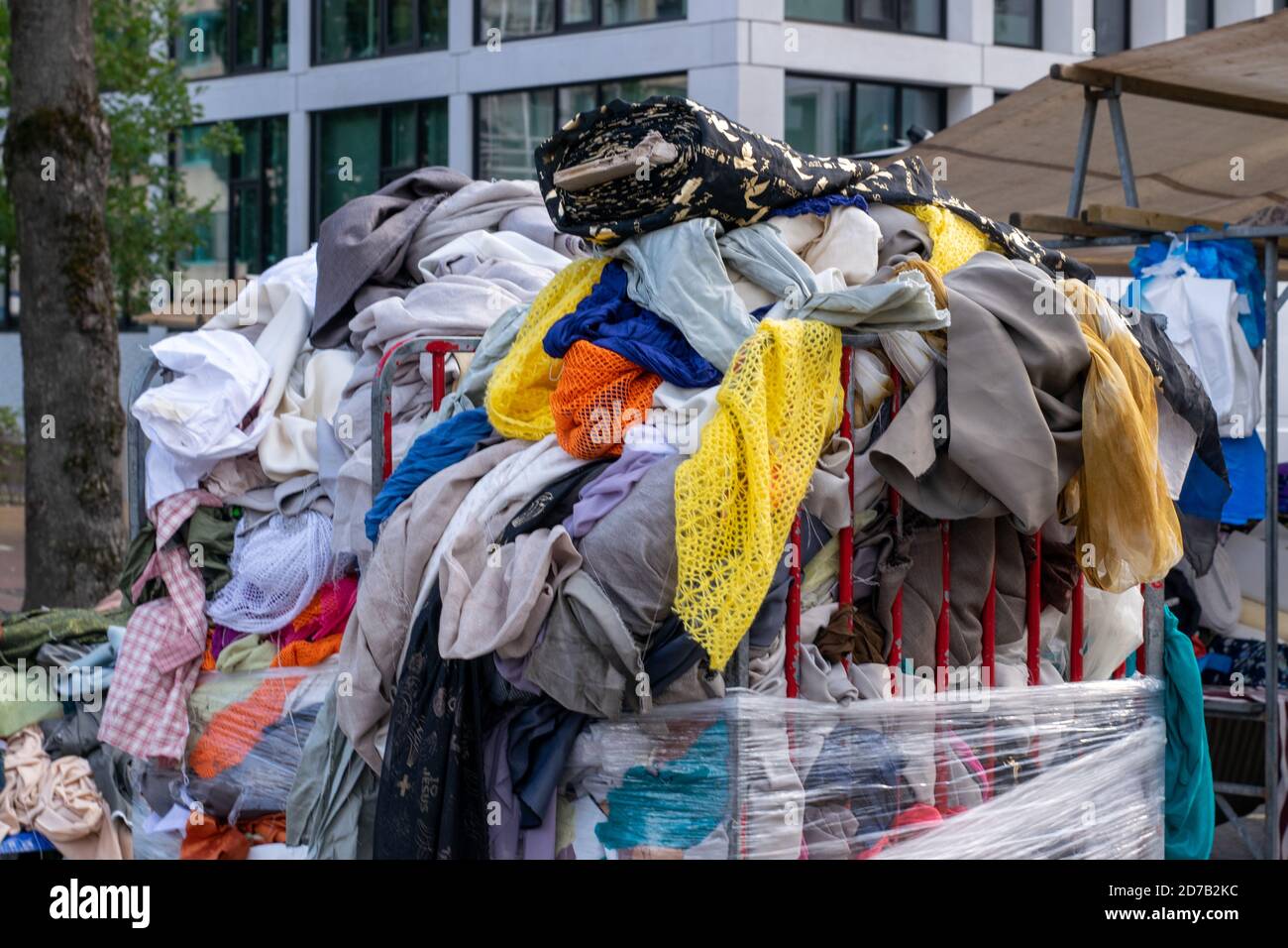 Pile of old clothes dumped in a container Stock Photo - Alamy