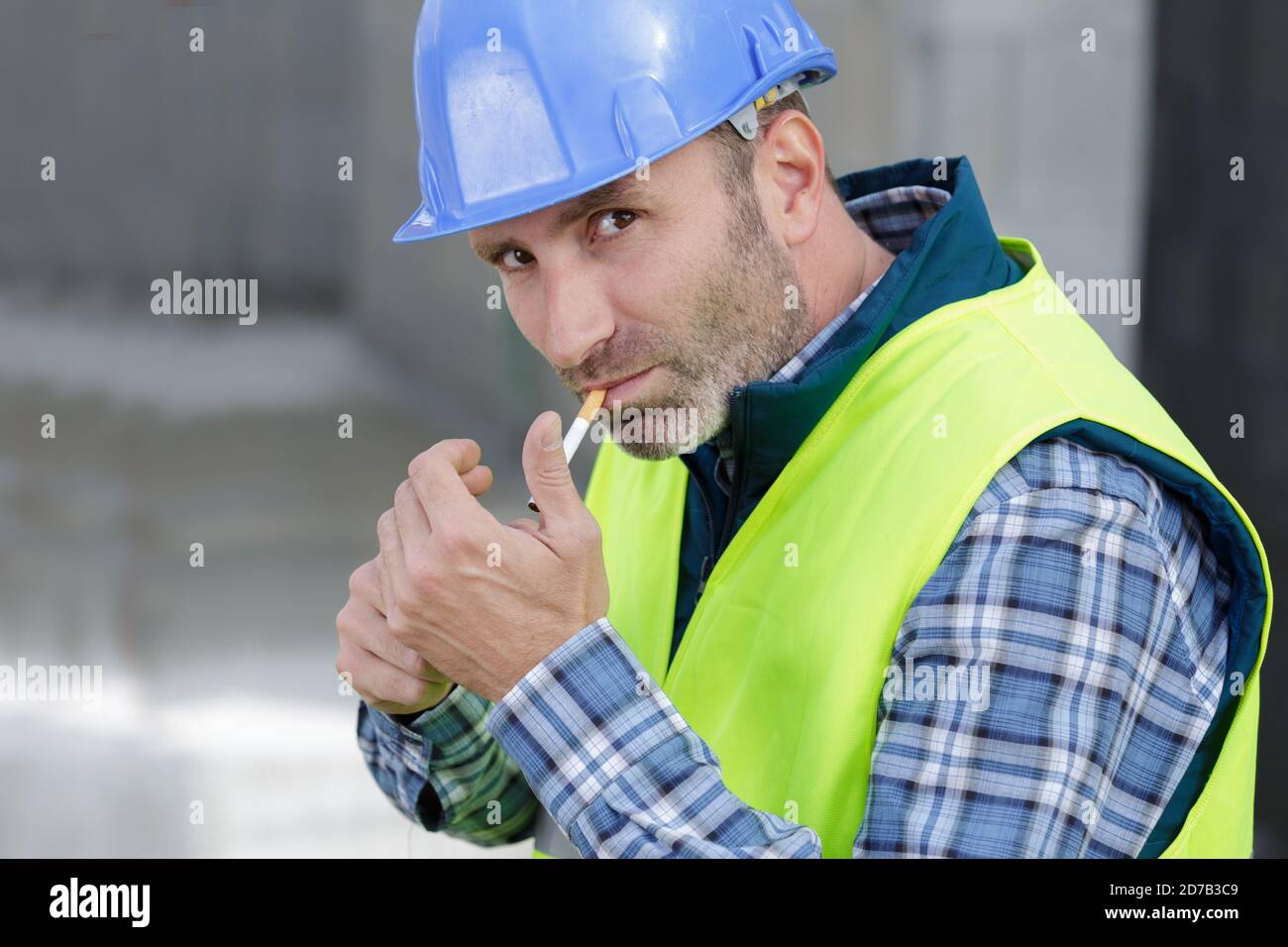 smoking cigarette on construction site Stock Photo - Alamy