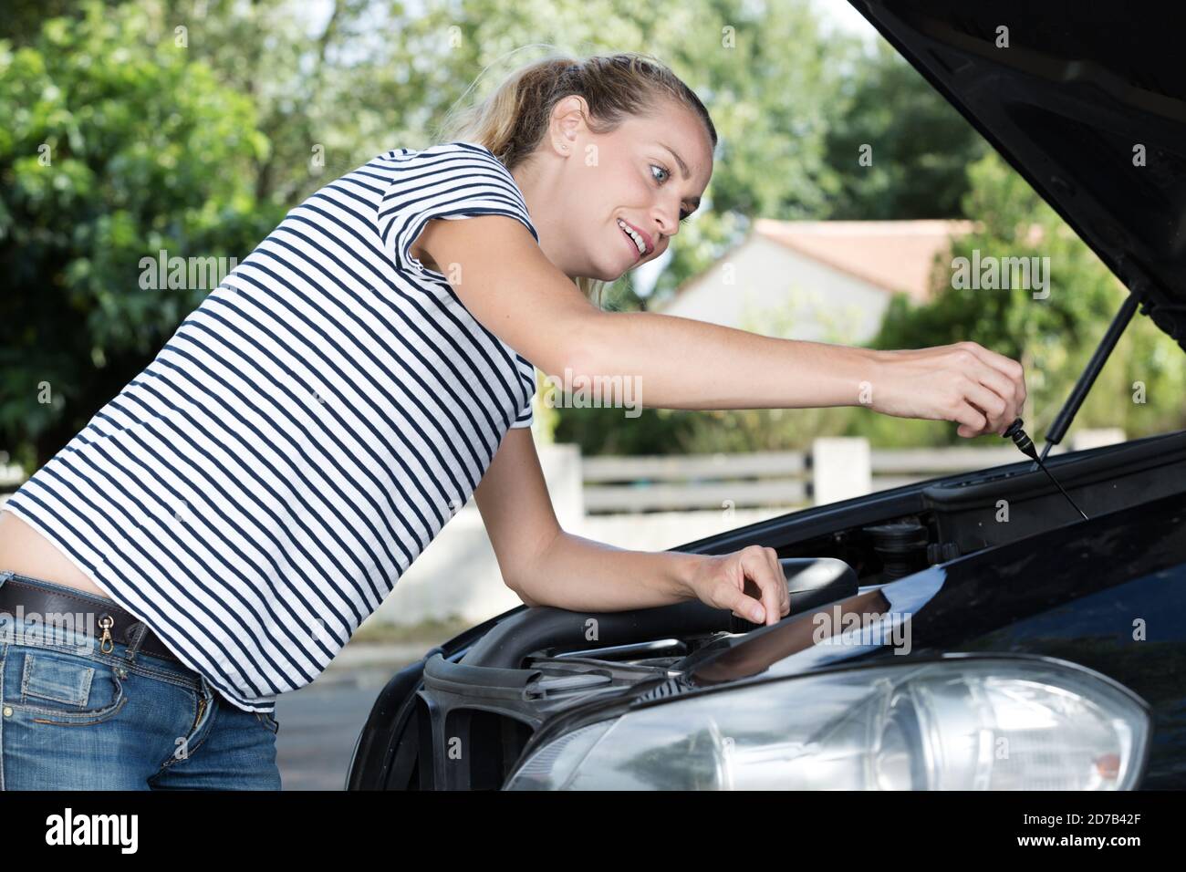 Woman fixing car hi-res stock photography and images - Alamy