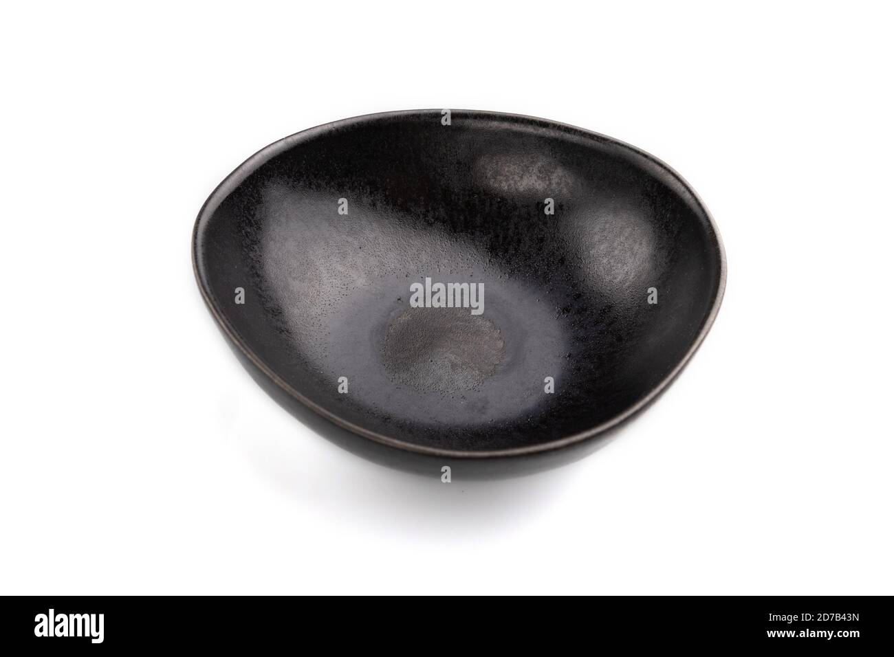 Empty black ceramic bowl isolated on white background. Side view, close ...
