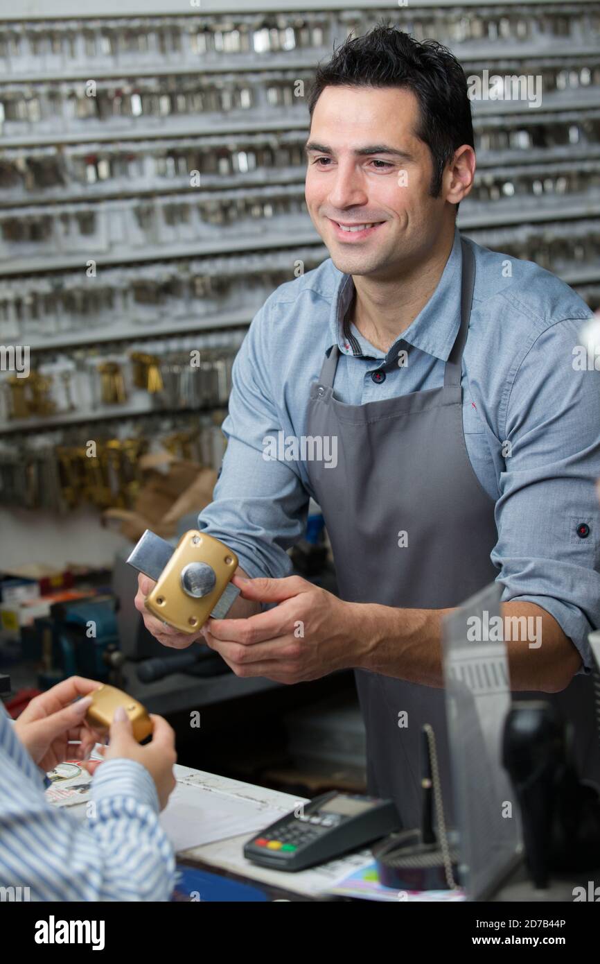 key cutter showing lock mechanism to customer Stock Photo - Alamy