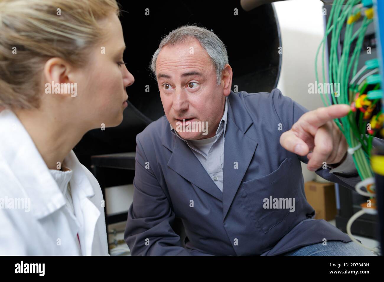technical instructor teaching female student Stock Photo - Alamy