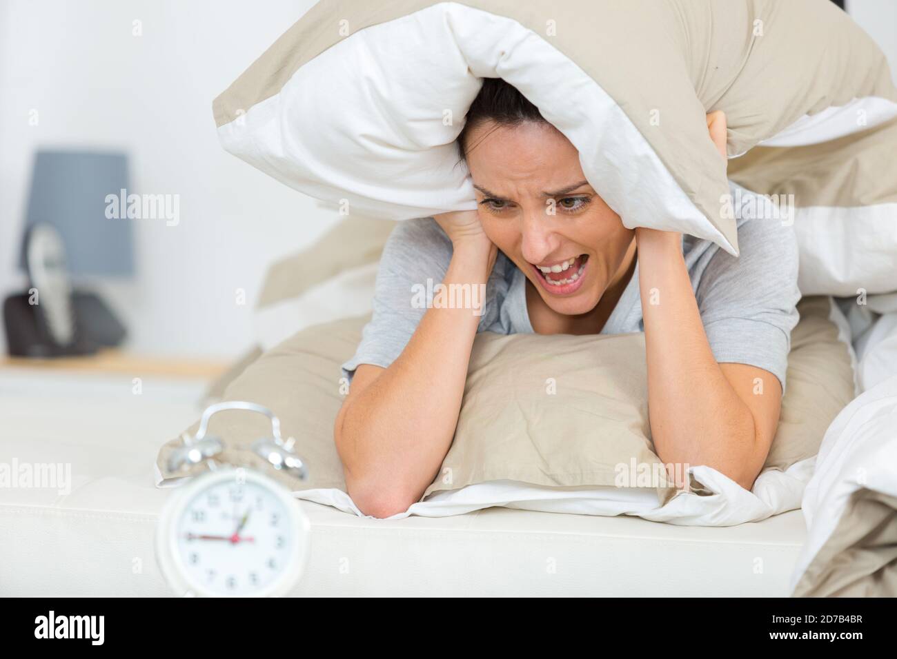 angry woman waking up Stock Photo - Alamy