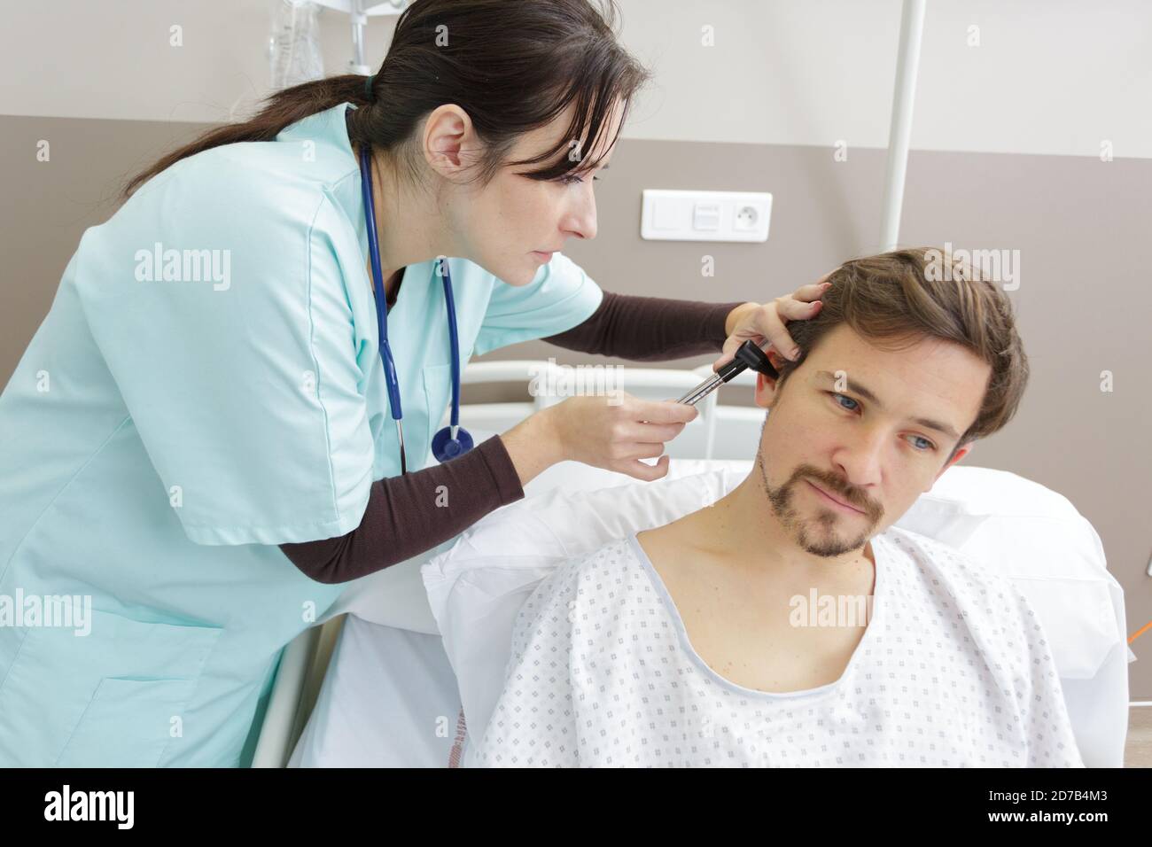 female doctor checks the ear Stock Photo - Alamy