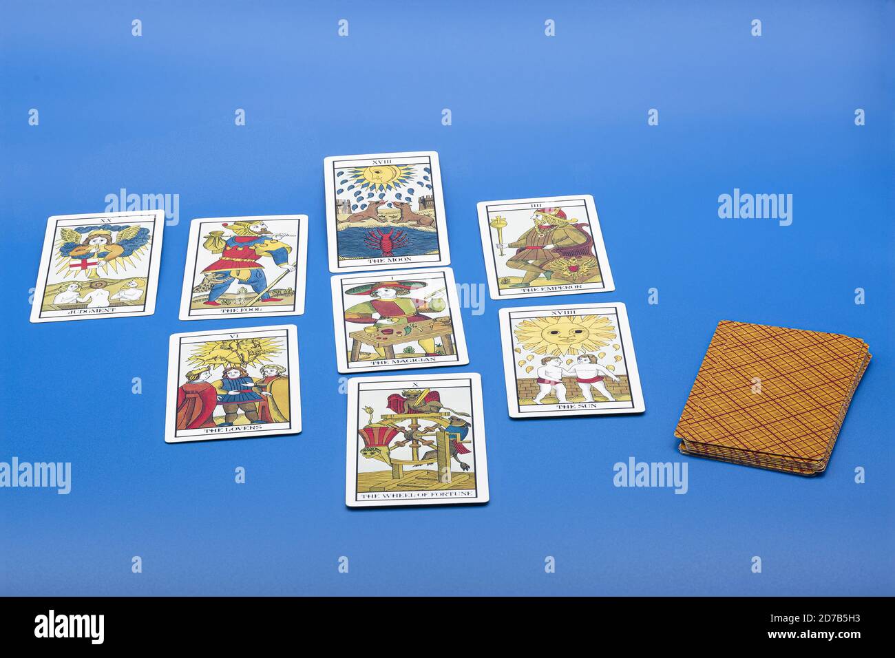 Tarot cards isolated on a blue background Stock Photo - Alamy