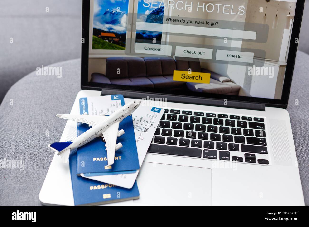 passport with laptop computer isolated on gray background. Business ...