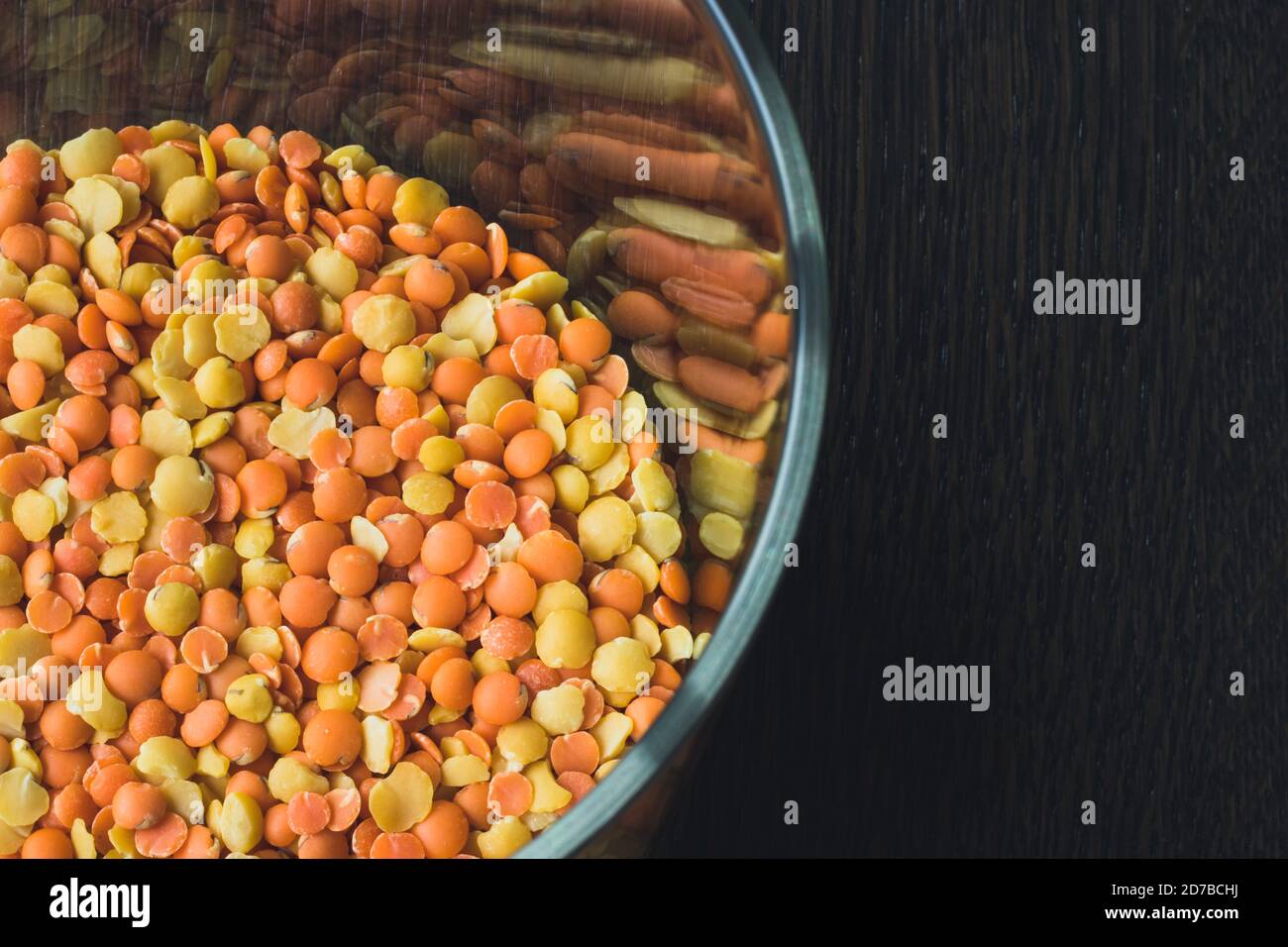 Glass pot full of red and yellow lentils Stock Photo - Alamy