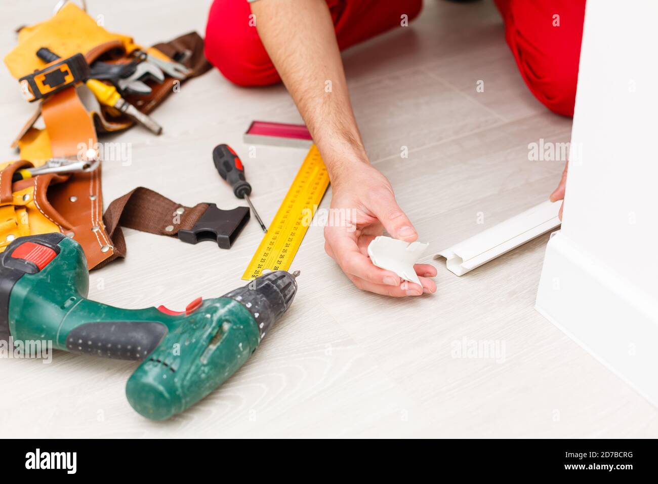 Installing the new skirting board after changing the parquet Stock ...