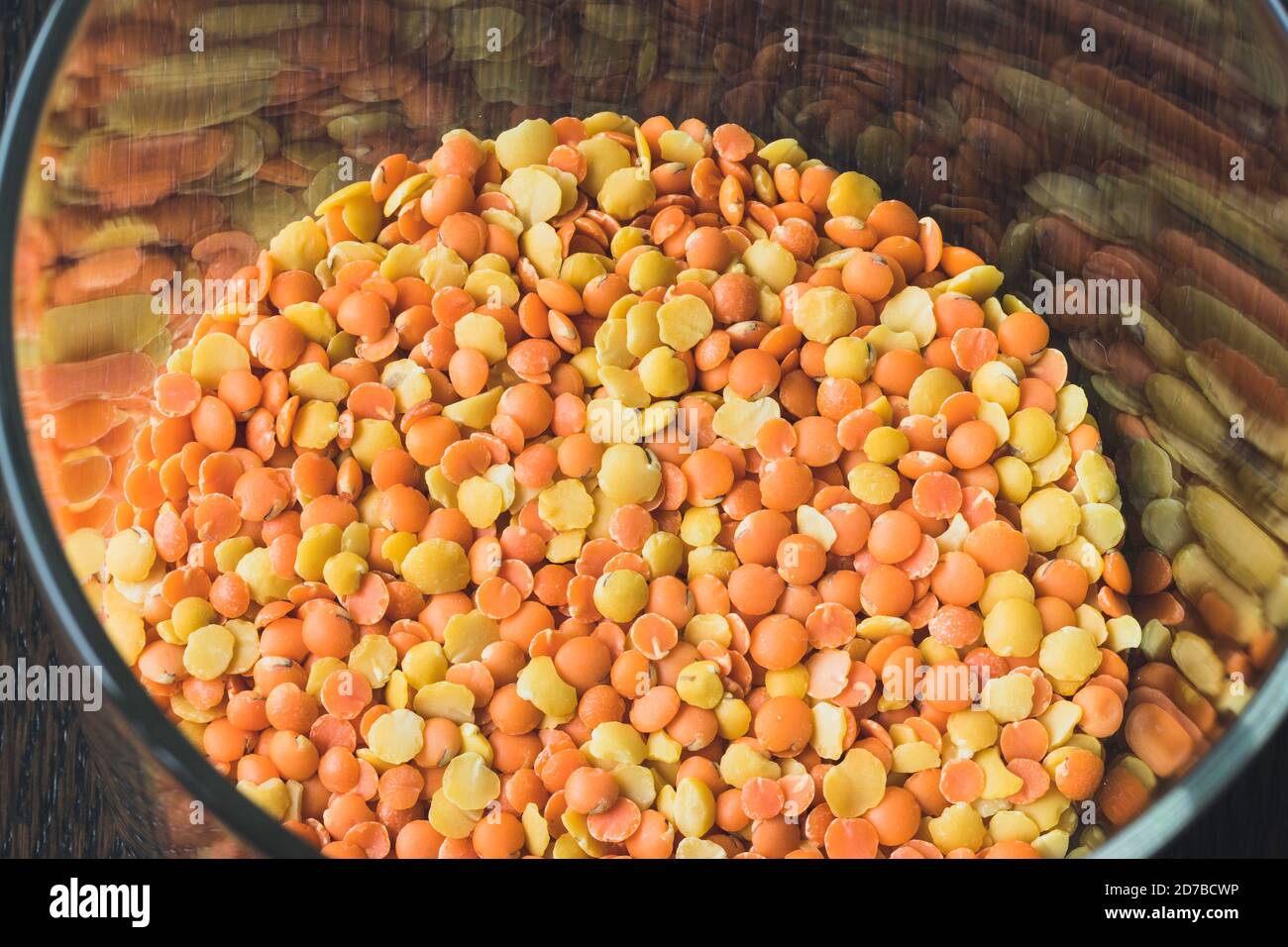 Glass pot full of red and yellow lentils Stock Photo - Alamy