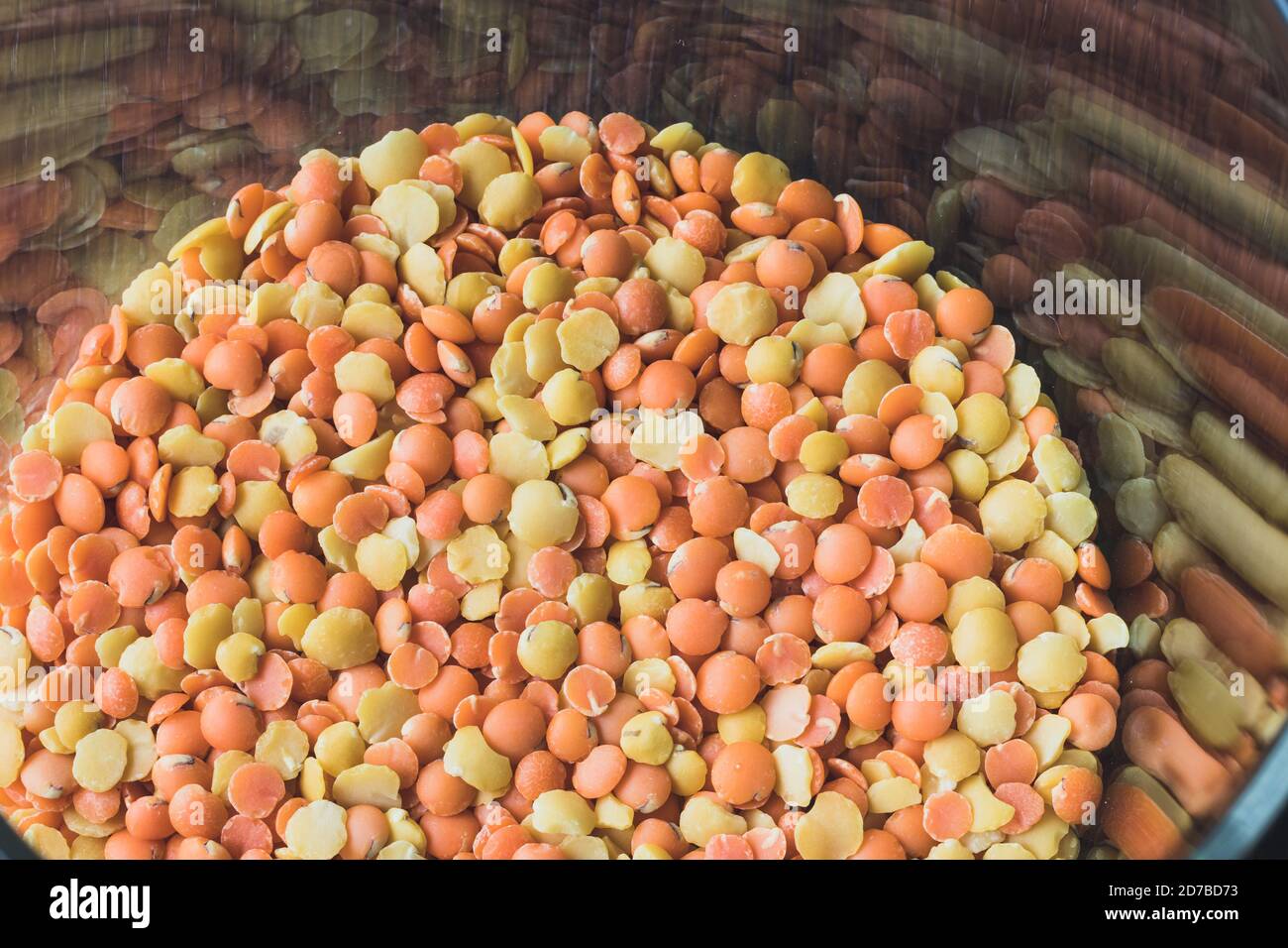 Glass pot full of red and yellow lentils Stock Photo - Alamy