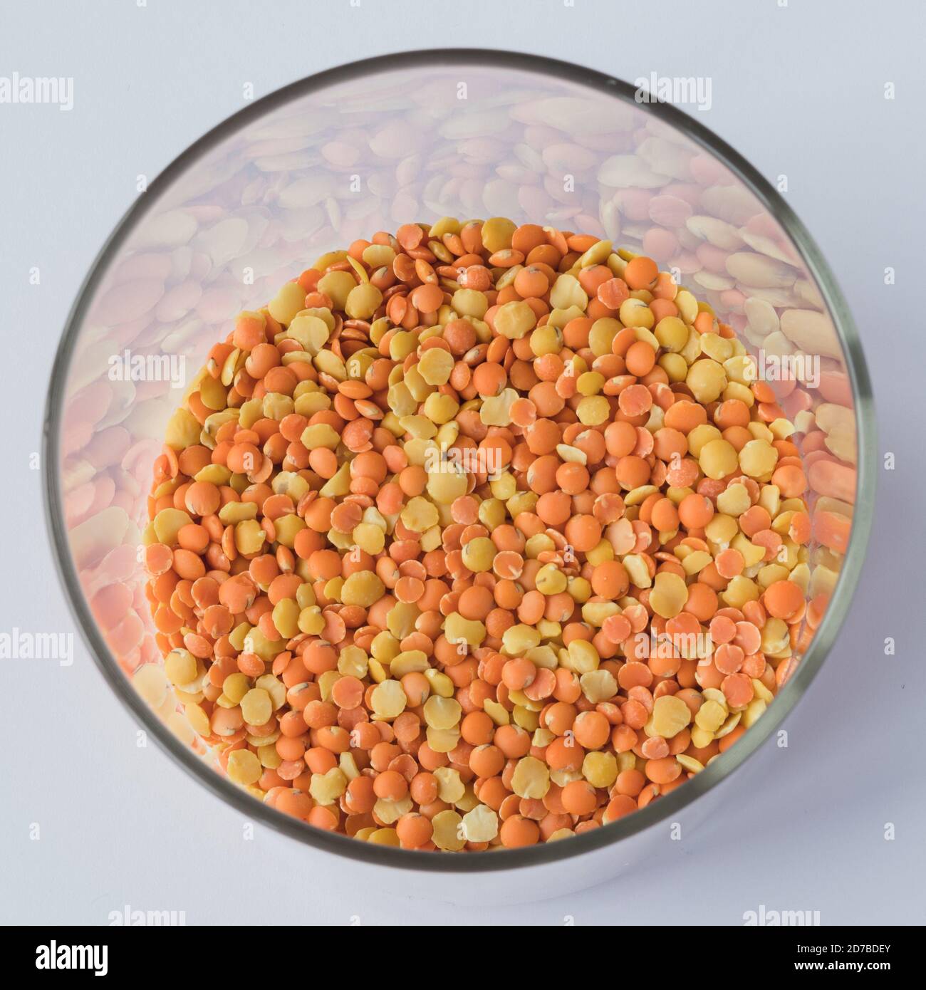 Glass pot full of red and yellow lentils Stock Photo - Alamy