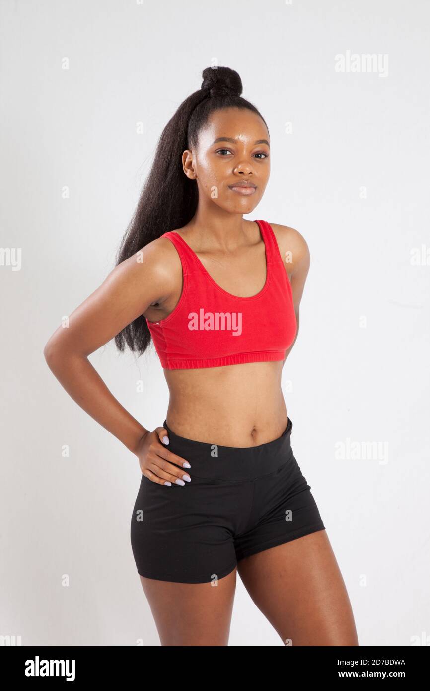 Lovely woman with her hand on her hips Stock Photo - Alamy