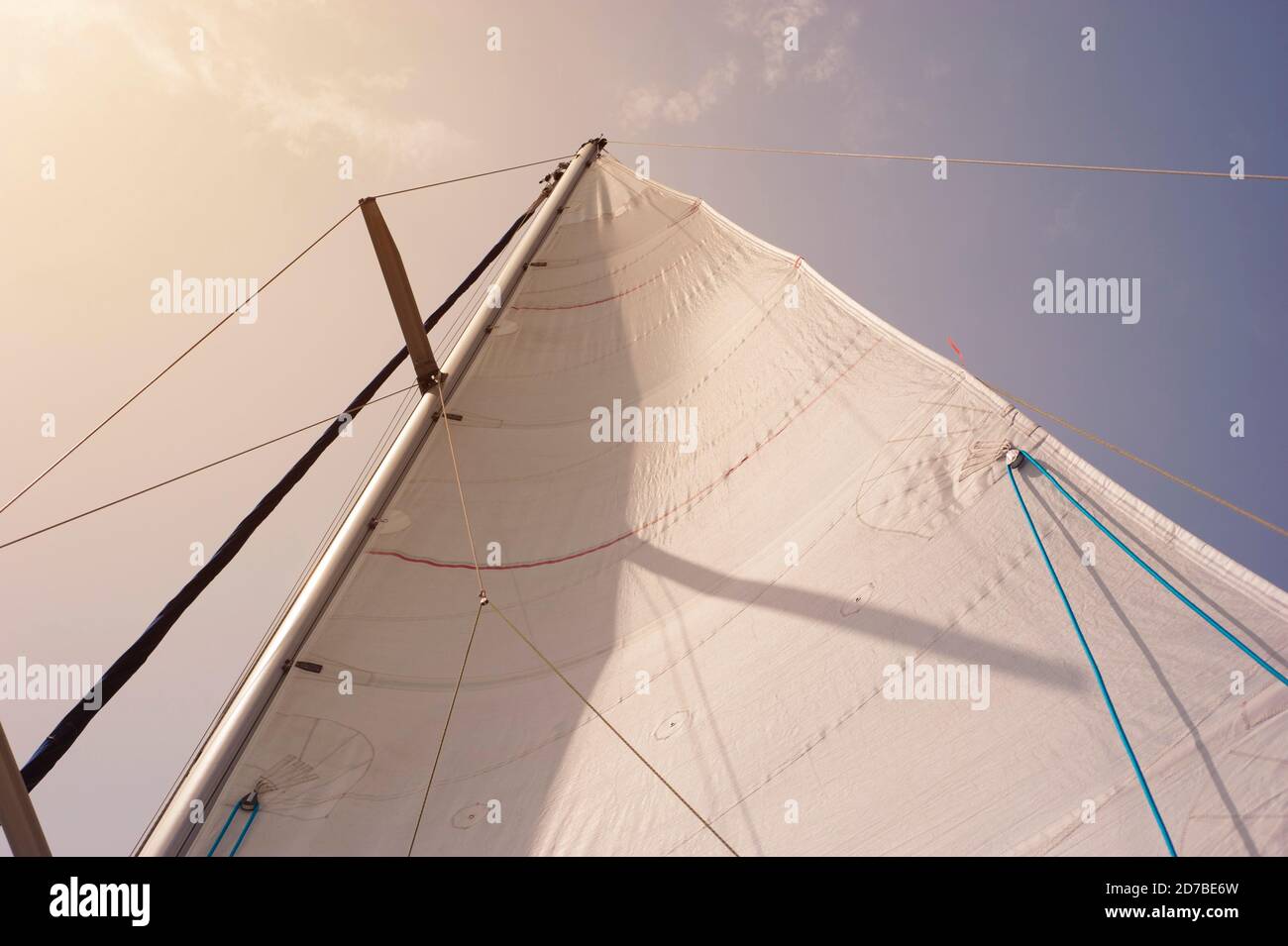 White sail catching the wind Stock Photo - Alamy