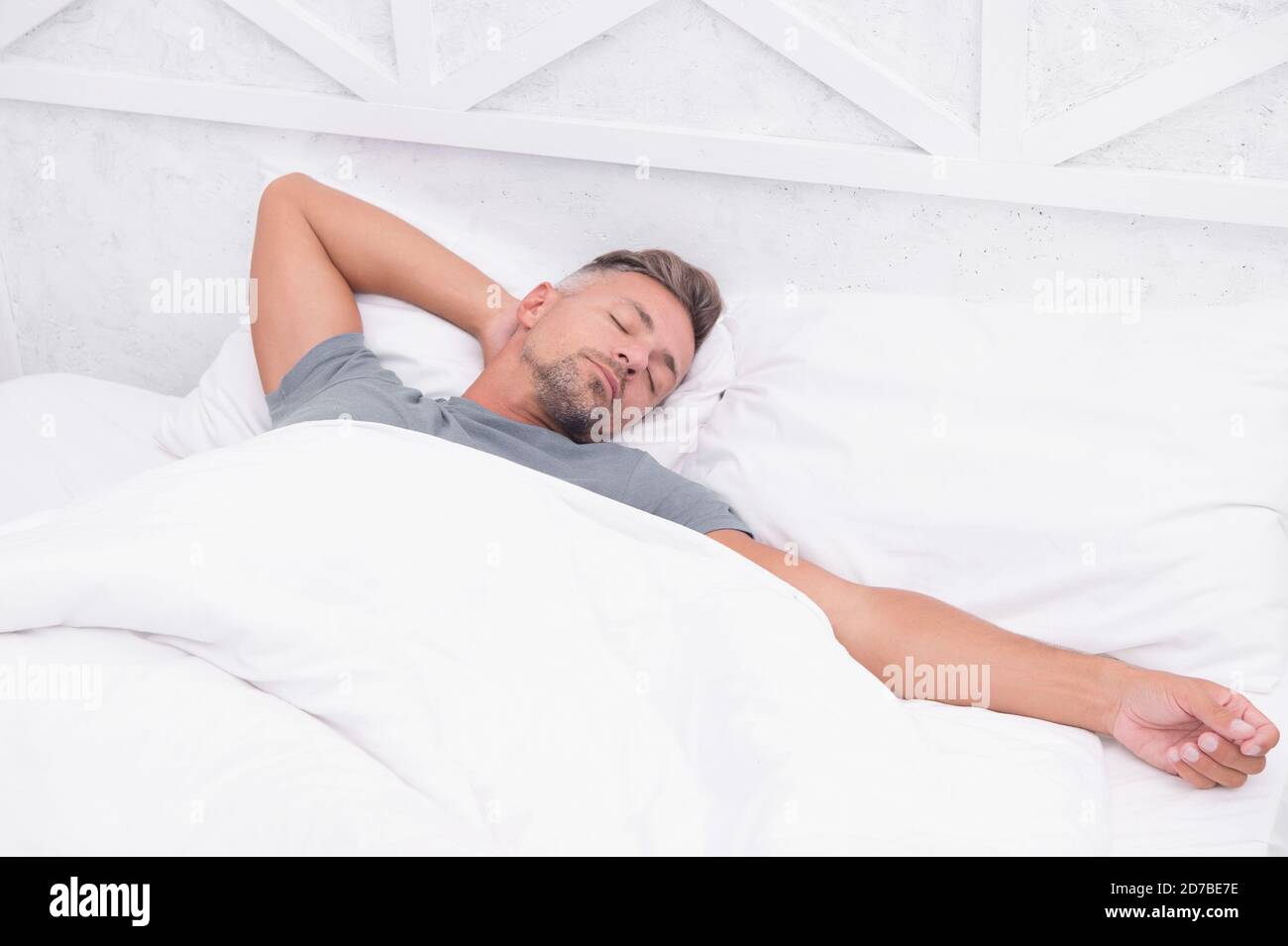 Tips sleeping better. Bearded peaceful man sleeping face relaxing on ...