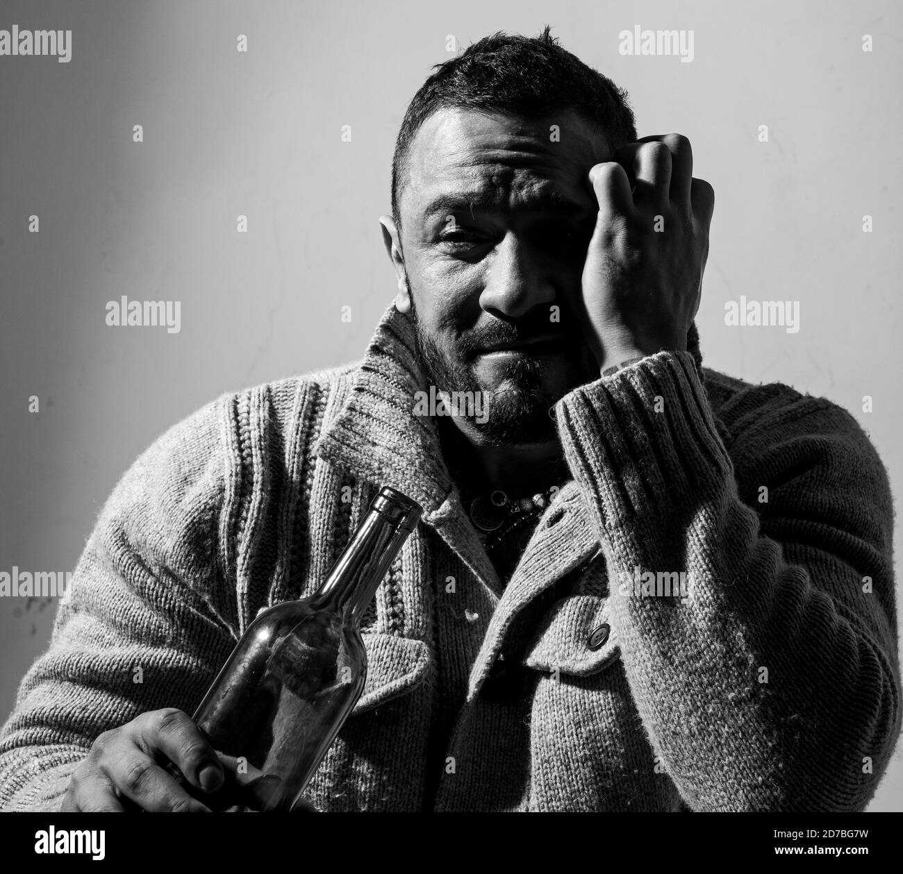 He is a recovering alcoholic. Depressed latino man drinking alcoholic ...