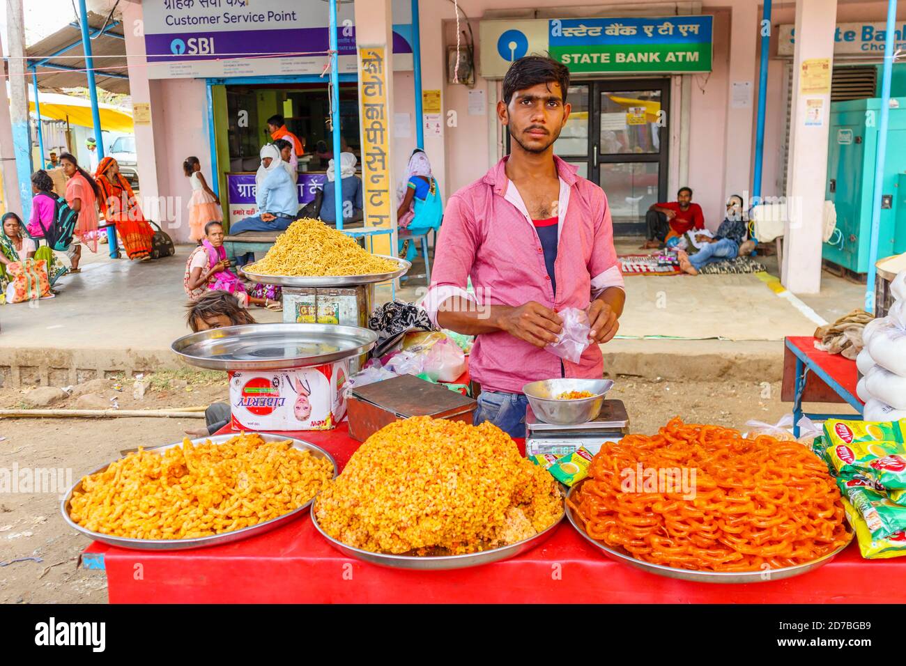 Stall selling street food and local produce including jalebi and sweet ...