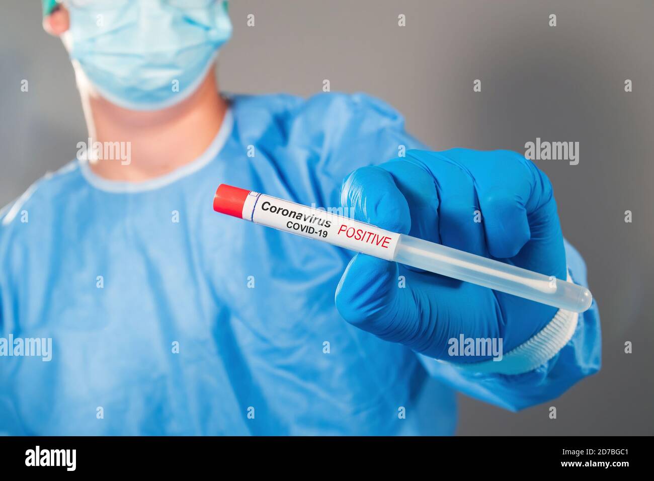 Virologist holding coronavirus swab test sample in a vial with gloves ...