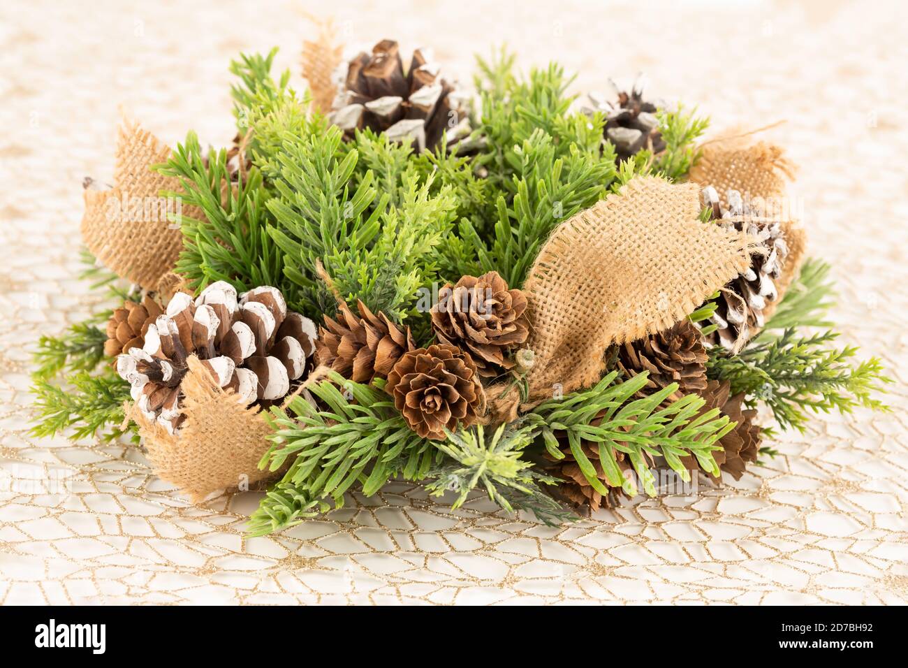 Christmas decoration with burlap ribbon and cones on the golden net ...