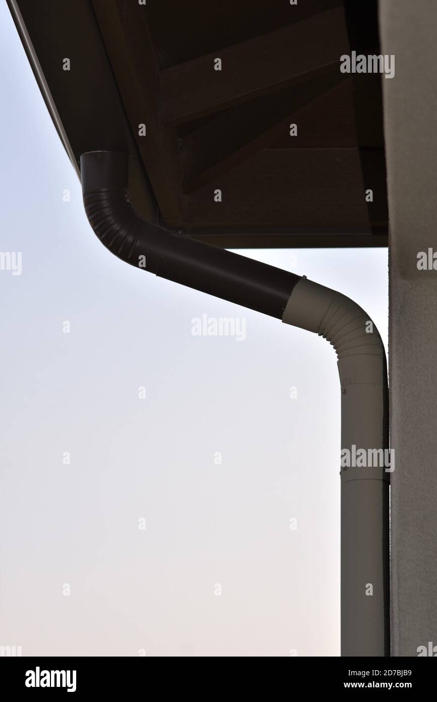 Gutter and drainage pipe from a roof Stock Photo - Alamy