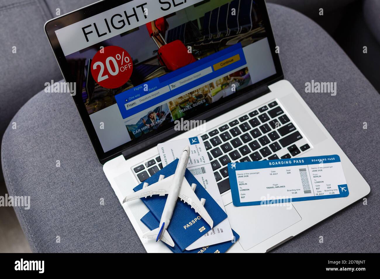 passport with laptop computer isolated on gray background. Business ...