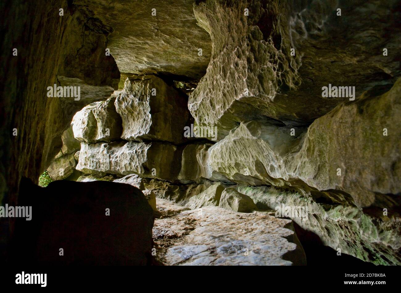 Entrance to a low bedding cave viewed from the inside, at Kingsdale ...