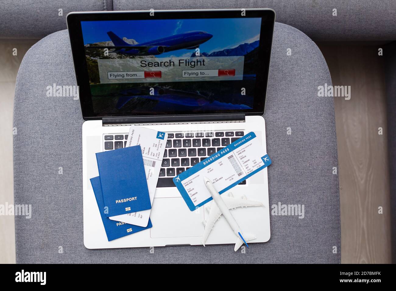 passport with laptop computer isolated on gray background. Business ...