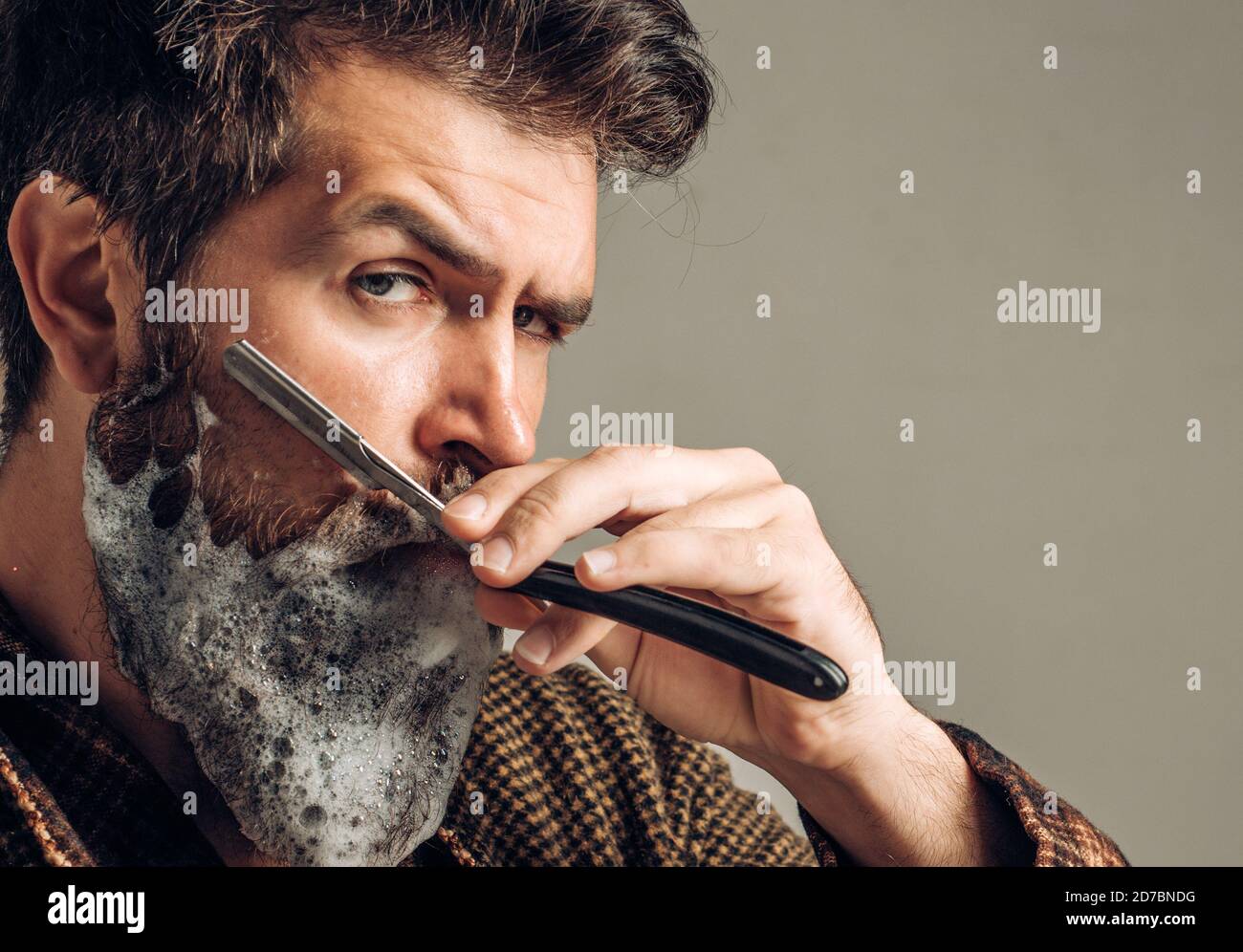 Man shaving in the house in the bathroom. Barber shop concept ...
