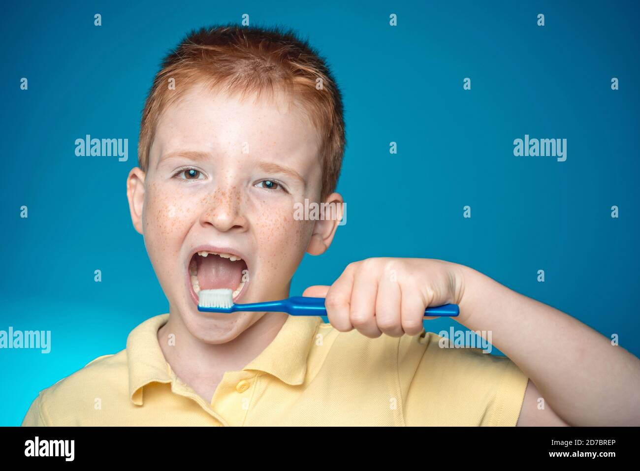 Boy is brushing his teeth. Happy child kid boy brushing teeth. Smiley ...