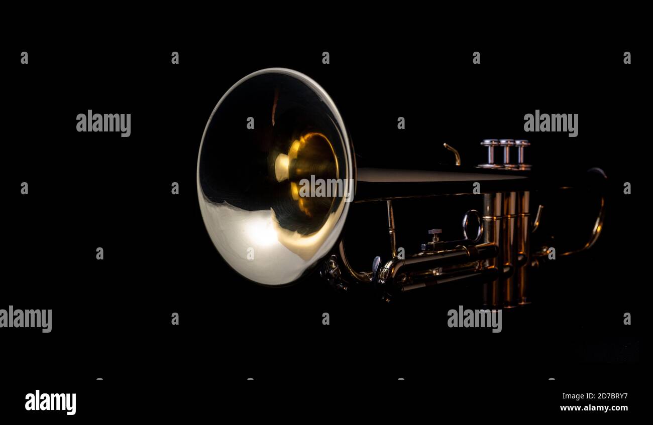 Brass instruments, golden trumpet in the dark Stock Photo - Alamy
