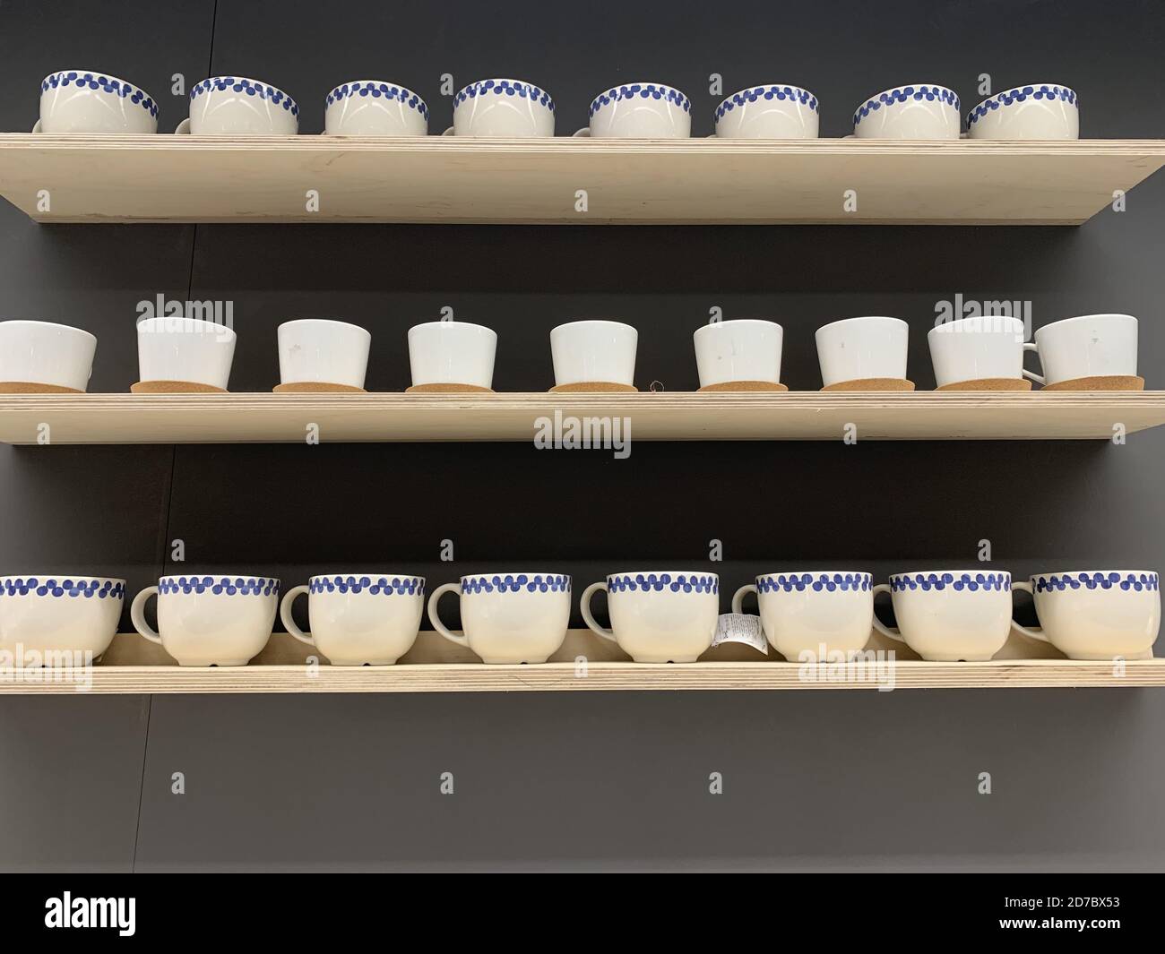 Shot of white cups on a shelf Stock Photo - Alamy