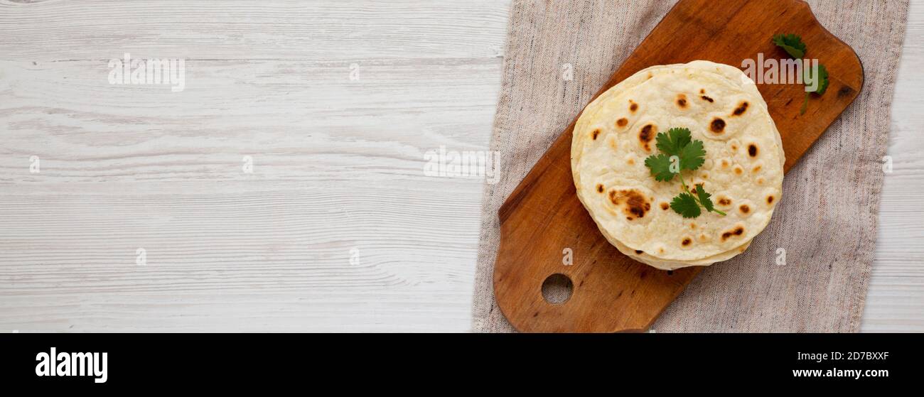 Homemade Roti Chapati Flatbread on a rustic wooden board, top view ...