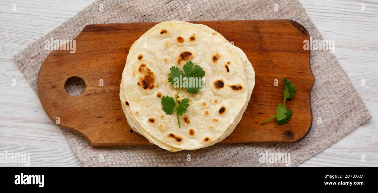 Homemade Roti Chapati Flatbread on a rustic wooden board, top view ...