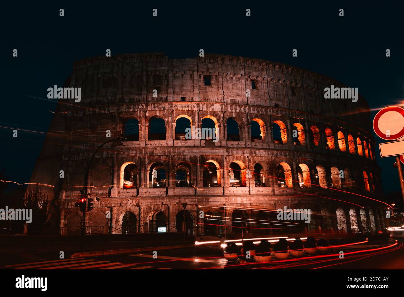Colosseum and road signs . Night view of antique Rome Stock Photo - Alamy