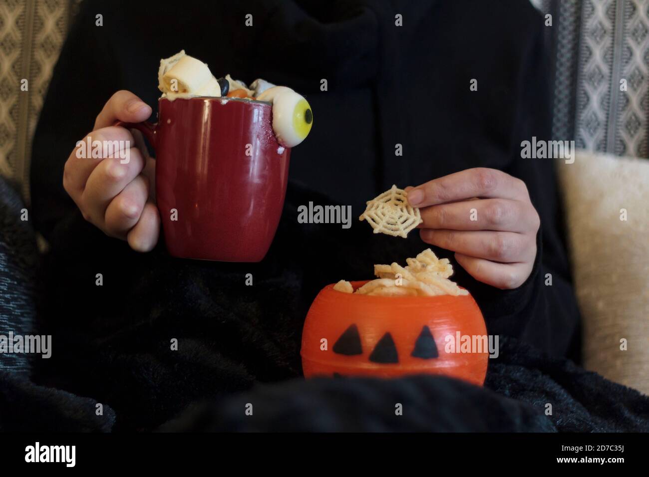 Woman sofa eating halloween hi-res stock photography and images - Alamy