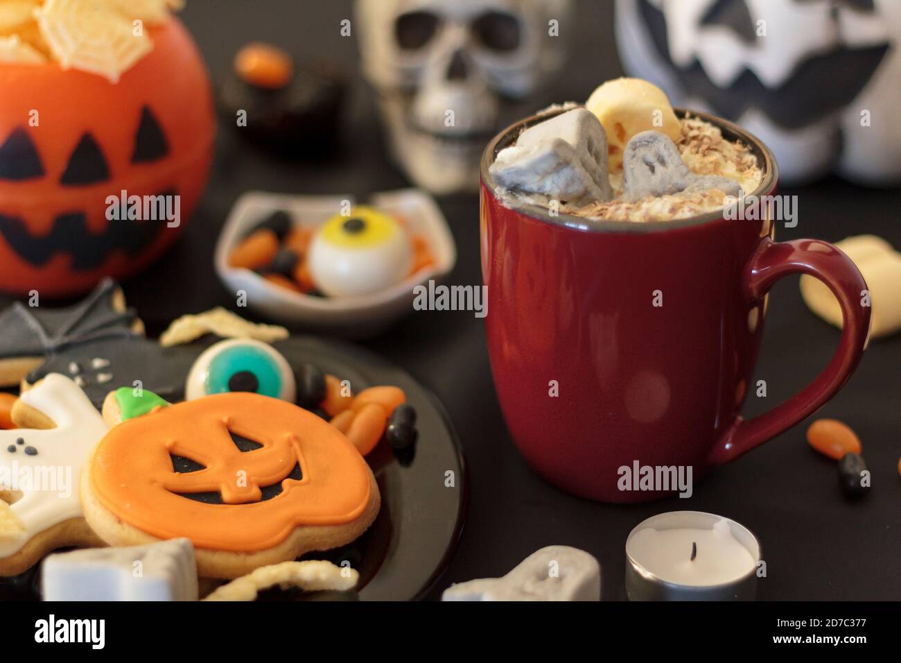 Halloween table with spooky treats and scary decoration Stock Photo - Alamy