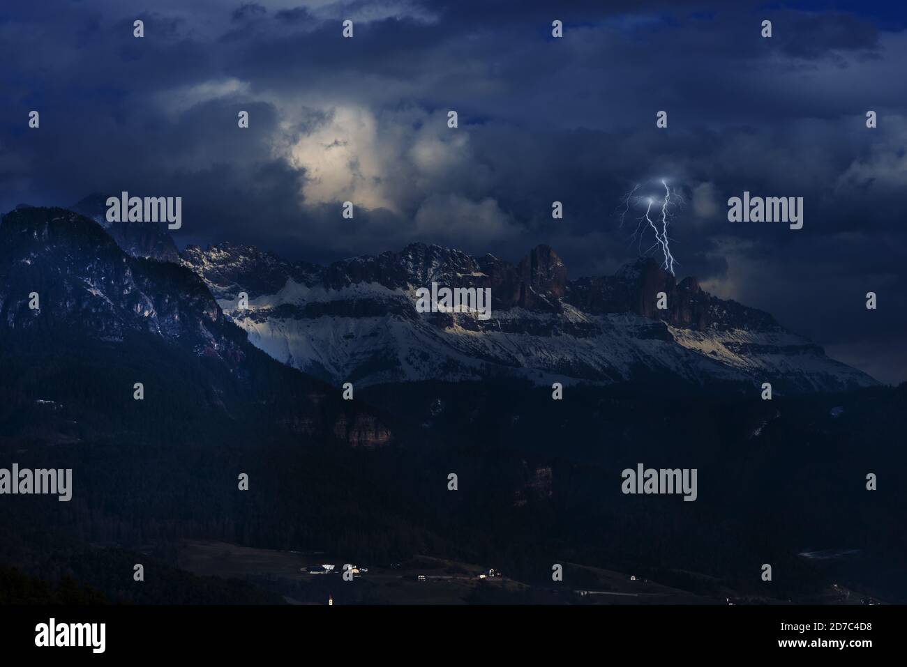 Breathtaking scene of mountains under cloudy sky getting struck by ...