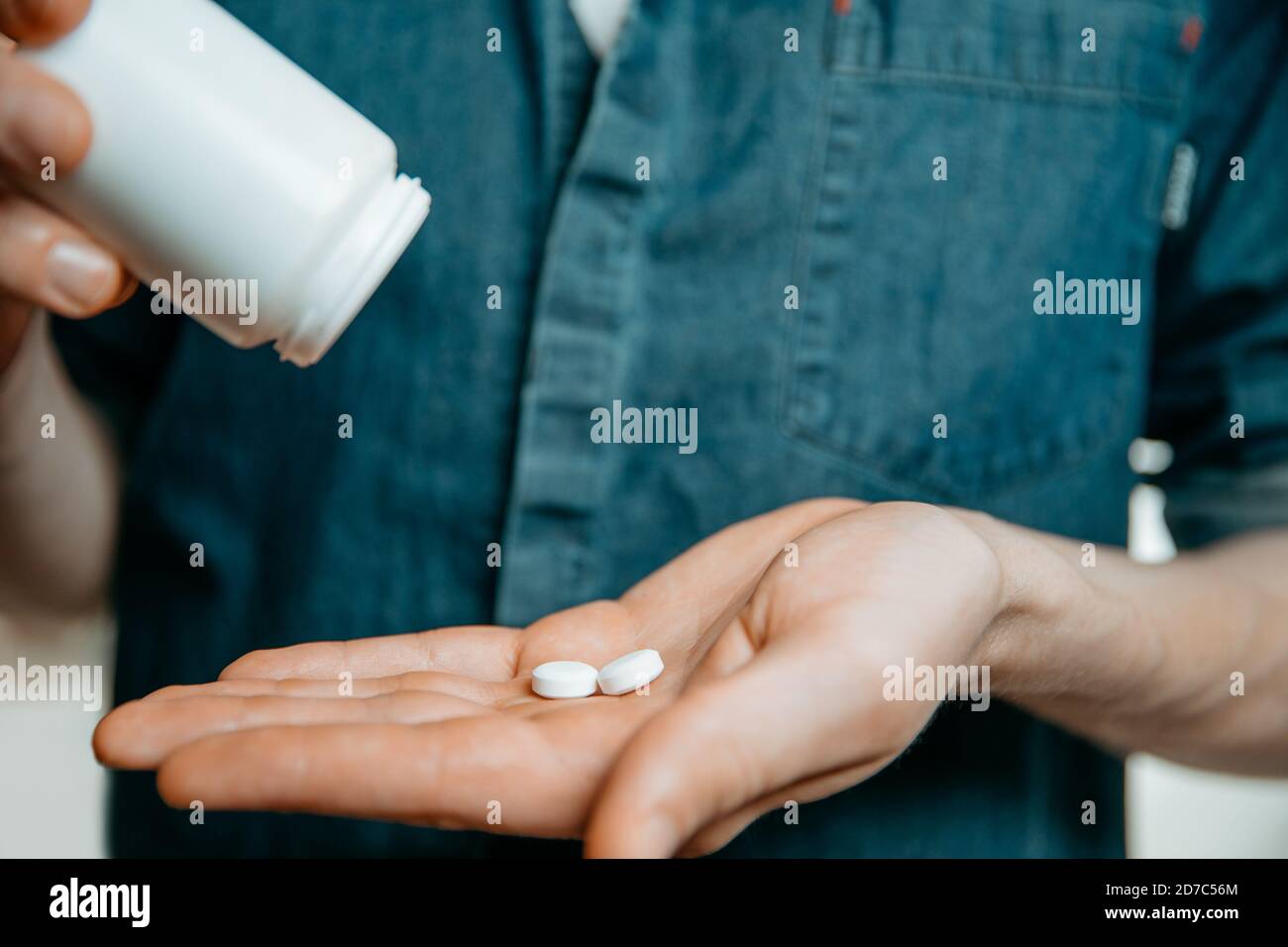 close up. two tablets in the palm of a person's hand Stock Photo - Alamy