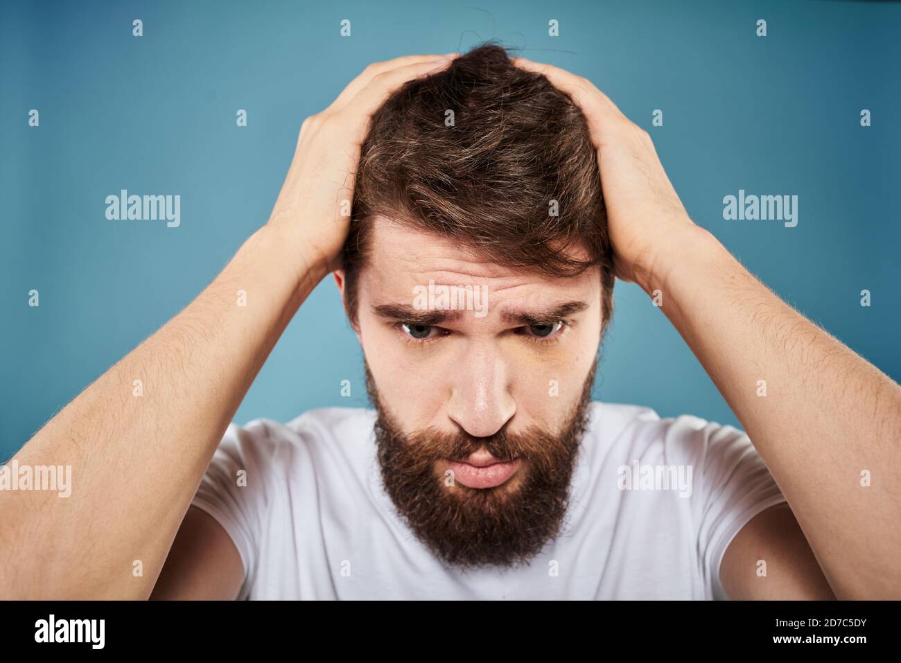 Bearded man displeased facial expression emotions close-up blue ...
