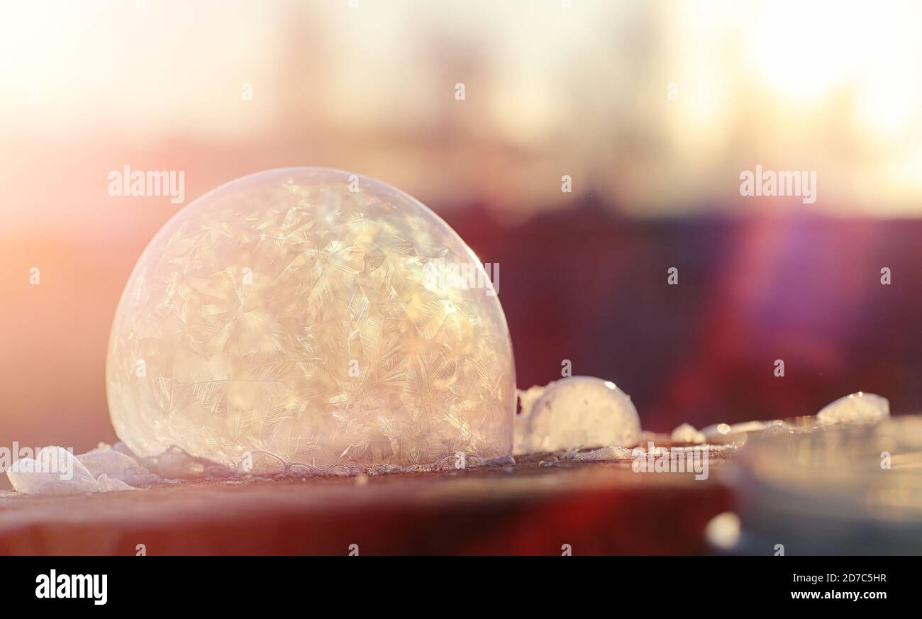 Soap bubbles freeze in the cold. Winter soapy water freezes in the air ...