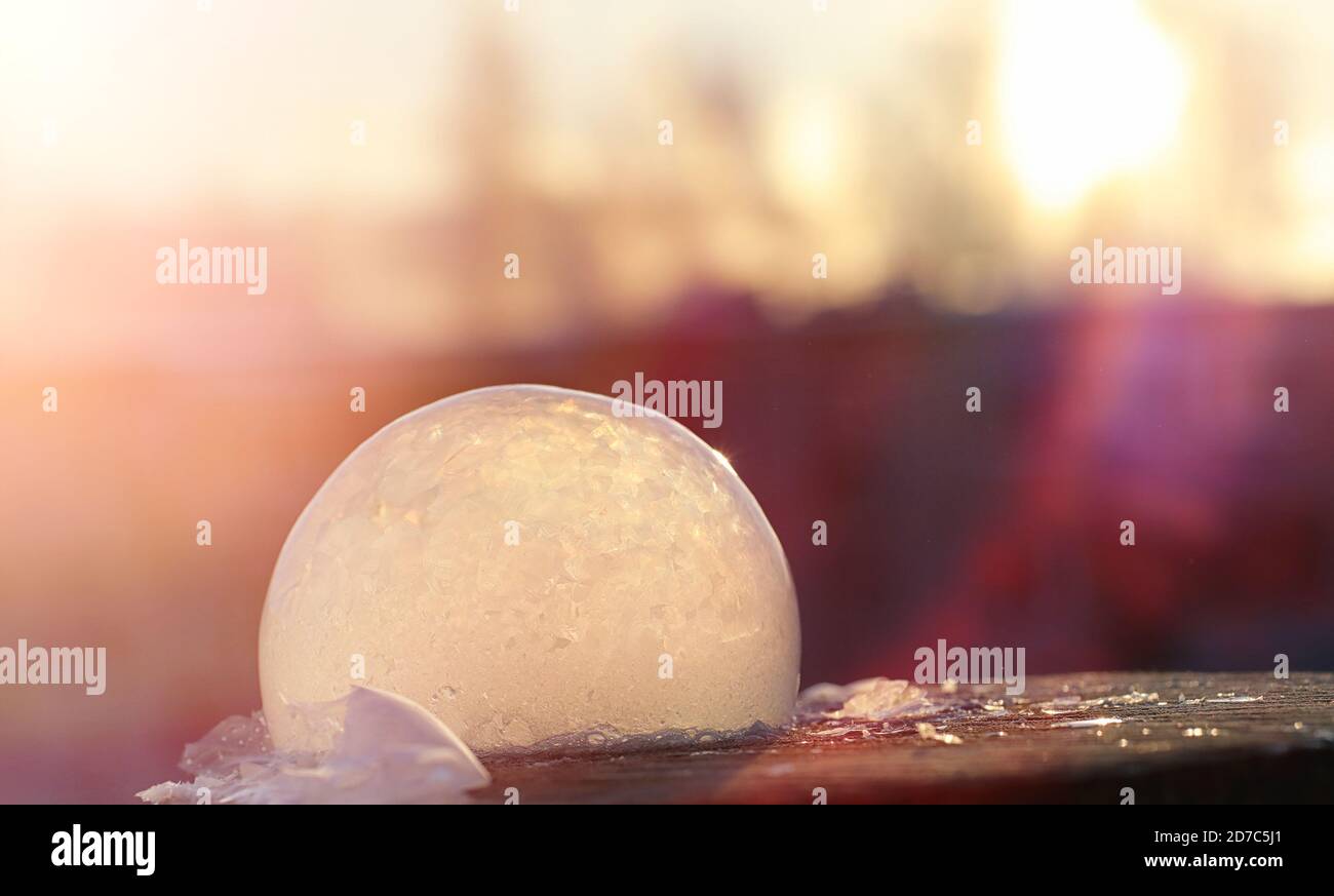 Soap bubbles freeze in the cold. Winter soapy water freezes in the air ...
