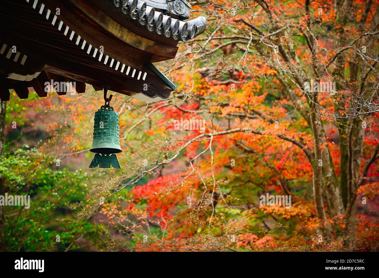 The eaves of the temple roof have rust-green bells, the background of ...