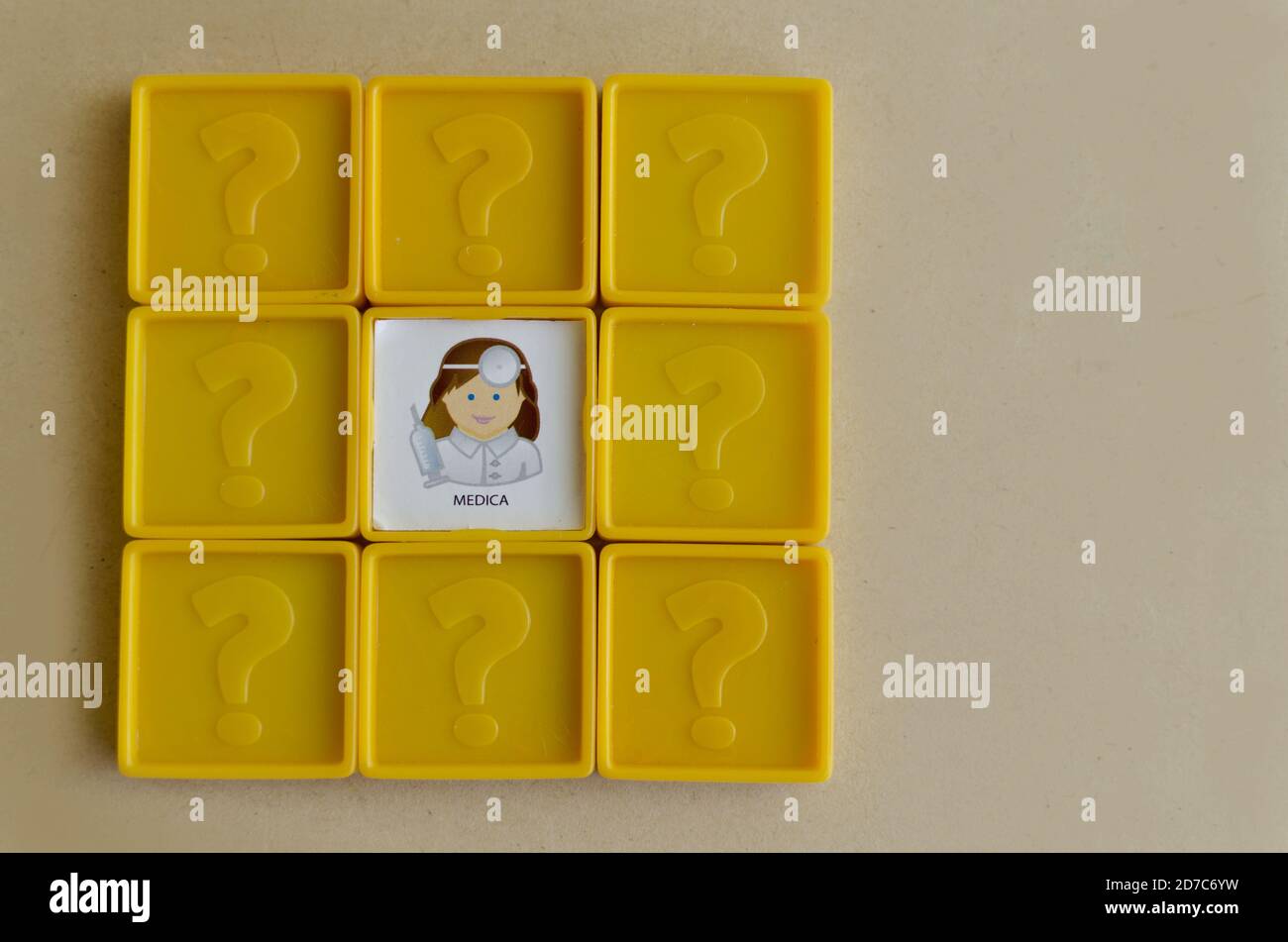 Top view of yellow chips with question mark and professions Stock Photo ...