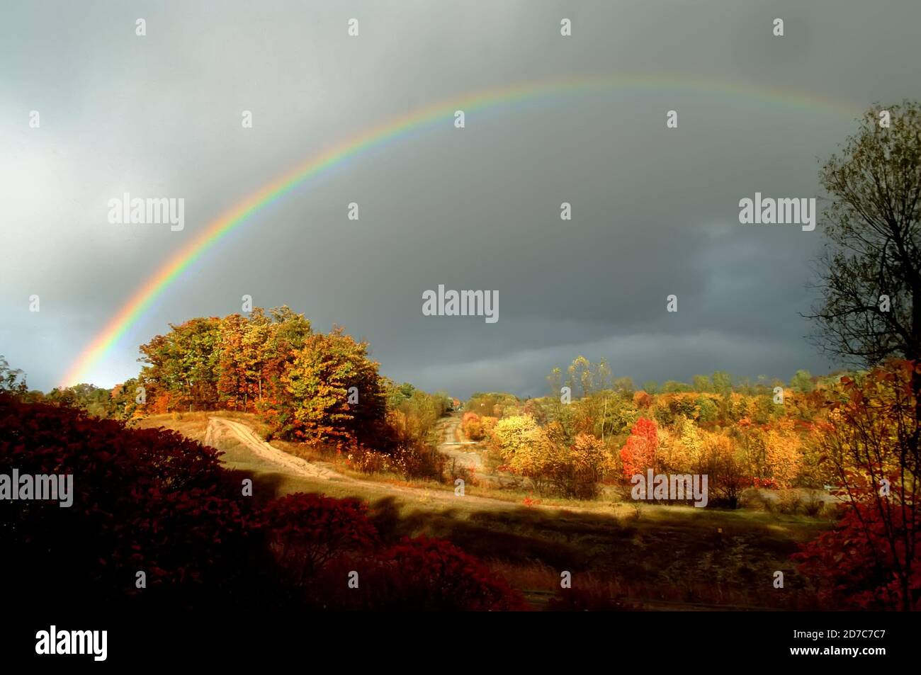 Rainbow during fall colors Michigan Stock Photo - Alamy