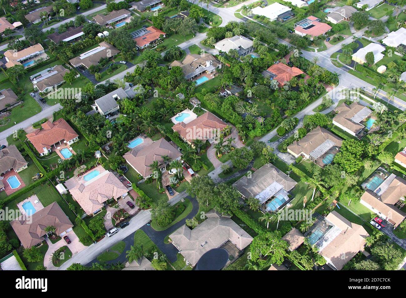 Aerial overview of tropical homes in a suburban Maimi neighborhood ...