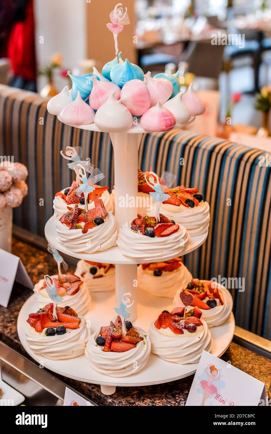 Vertical shot of a big assortment of various desserts in the restaurant ...