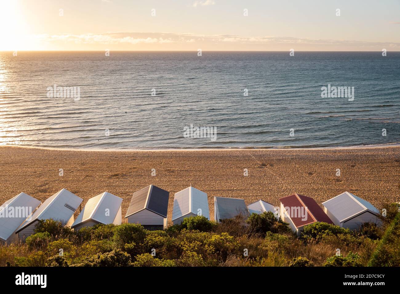 sunset over the beach boxes Stock Photo - Alamy